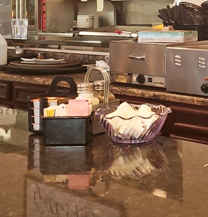 The condiment corner&mdash;where ketchup, sugar packets, and napkins patiently wait to complete your dining experience.