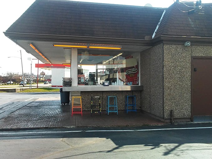 The counter seating offers a front-row view to short-order magic, where colorful stools have supported generations of hungry Daytonians.