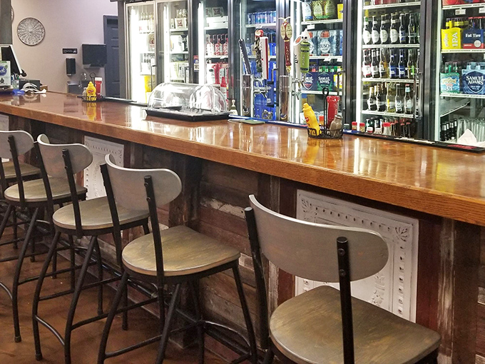 The bar seating area&mdash;where strangers become friends over shared appreciation of comfort food and cold beverages.