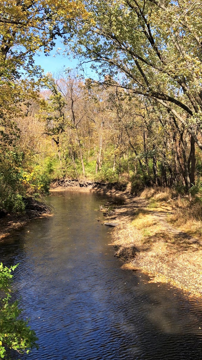 Sugar Creek meanders beneath, the same waters that have reflected this bridge for nearly two centuries.