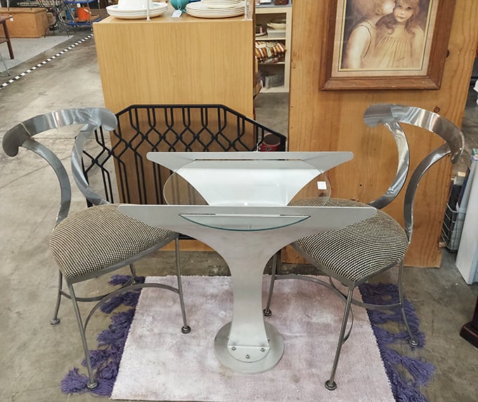 Space-age dining at its finest. This glass and chrome set looks ready for The Jetsons to serve martinis.