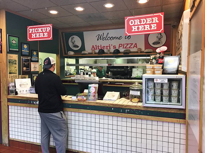 The sacred transaction: a hungry customer at the counter, moments away from the life-changing experience that is Altieri's food.