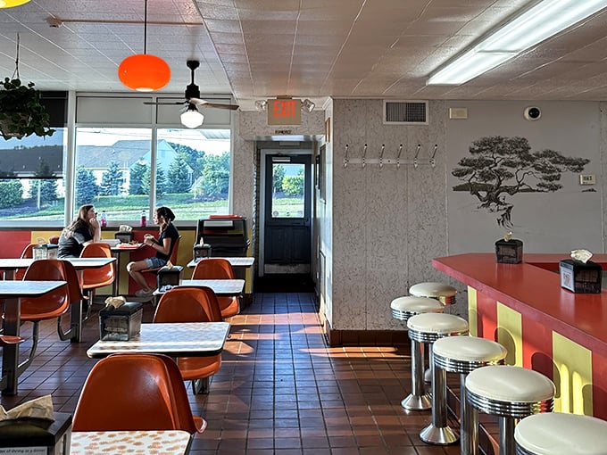 Sunlight streams through windows illuminating conversations that have been happening at these tables for generations.