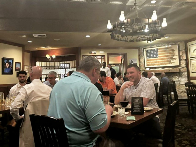 The dining room buzzes with the universal language of satisfied carnivores. Notice nobody's checking their phones?