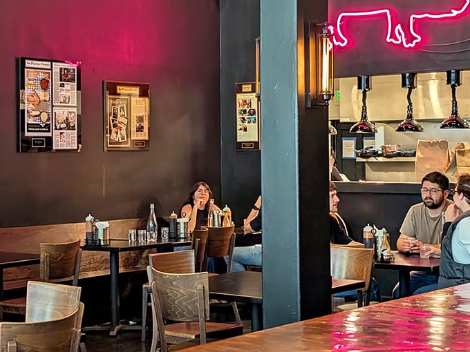 The dining room buzzes with that special energy that happens when strangers are united by the universal language of great barbecue.