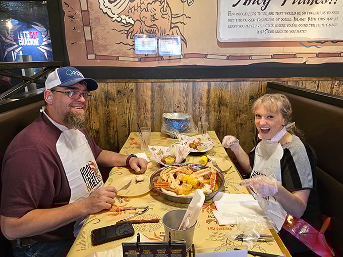 Happy diners suited up in bibs—the universal uniform that says "I'm about to have a deliciously messy time."