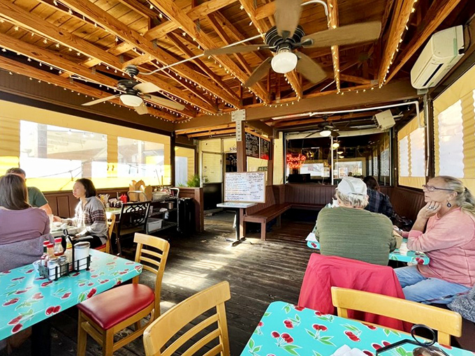 The covered patio offers a sun-dappled retreat where regulars and first-timers share tables and trading stories between bites.