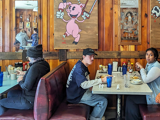 Booth seating and local art create the perfect backdrop for conversations that last through multiple coffee refills.