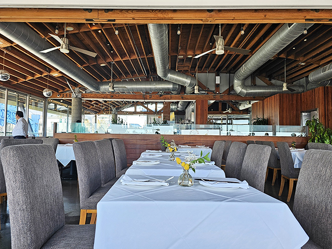 The dining room where memories are made. Those wooden beams overhead have witnessed countless proposals, celebrations, and first bites of perfect lobster.