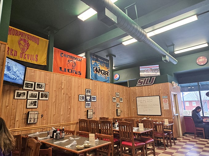 Local high school pennants hang like battle flags, telling stories of hometown pride and Friday night lights.