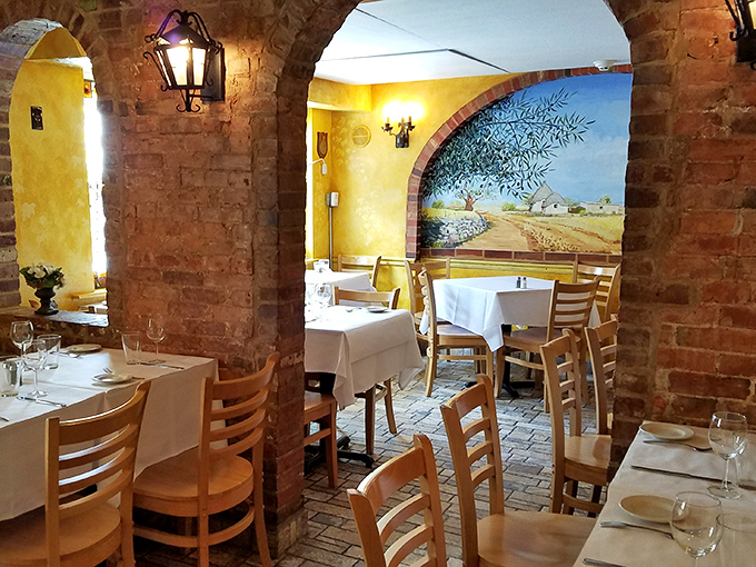 Dining rooms separated by rustic stone archways create intimate spaces for serious eating. This isn't a place for a quick bite&mdash;it's where meals become memories.