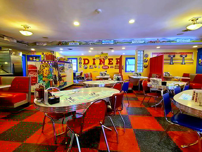 The checkerboard floor and vibrant walls aren't just decor&mdash;they're a mood enhancer. Even the empty tables seem to be telling stories of meals past.