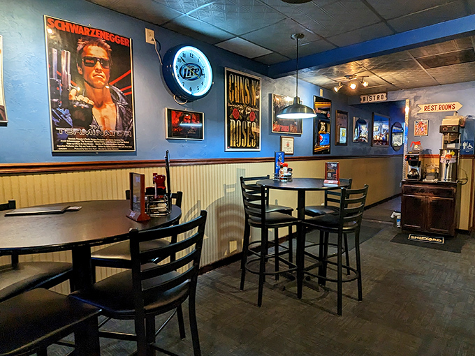 Movie posters and memorabilia create a pop culture shrine where Schwarzenegger watches over your meal like a cinematic guardian angel.