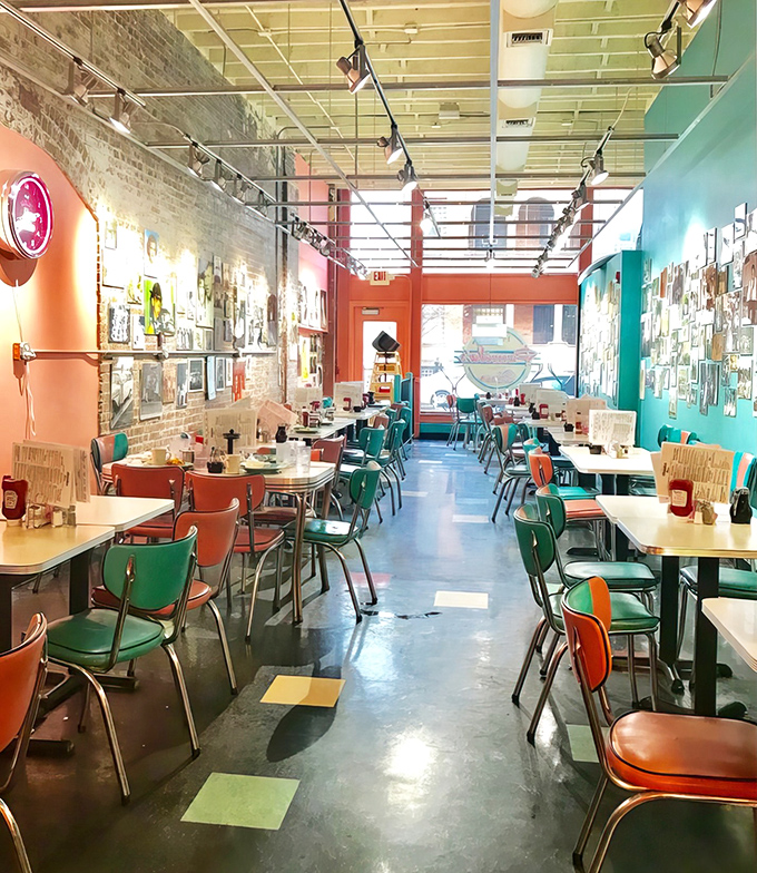 Colorful chairs and formica tables create the perfect canvas for breakfast masterpieces. This isn't interior design &ndash; it's breakfast theater in the round.