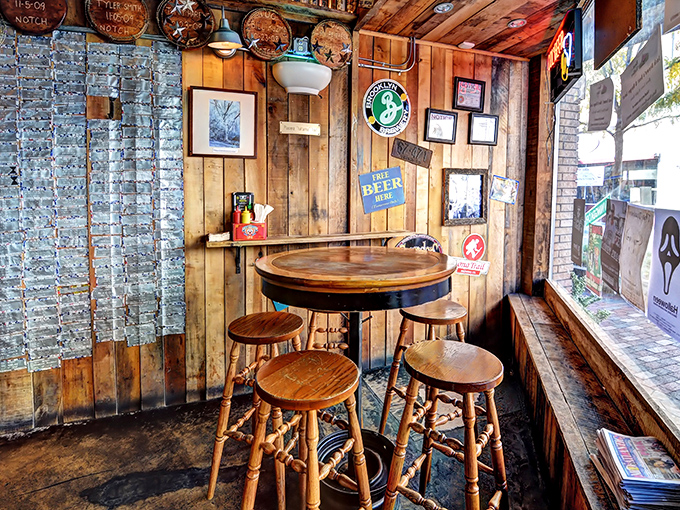 Wooden walls, barrel tables, and vintage signs create a corner where time slows down and conversations flow as smoothly as the craft beer.