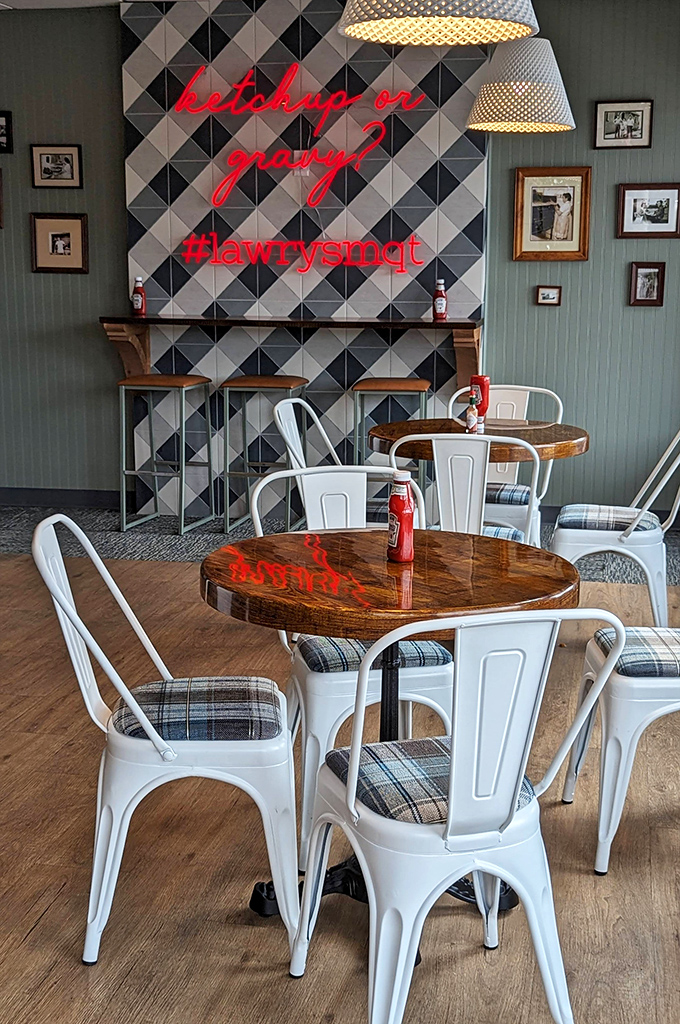 Modern meets tradition with geometric tiles and neon signage asking the eternal question: "ketchup or gravy?" (The correct answer is "yes").