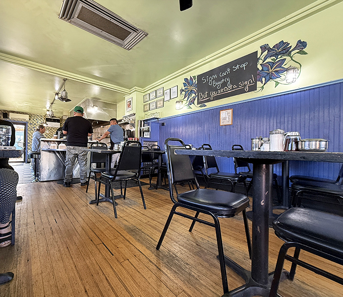 Blue wainscoting and wooden floors create the perfect backdrop for breakfast epiphanies. The wall art says it all: "Stop, can't stop, thinking about you."