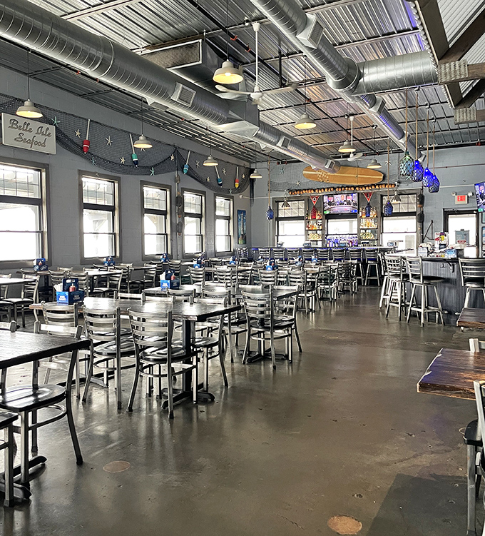 The dining room balances utilitarian simplicity with nautical touches, creating an atmosphere where the food, not the decor, takes center stage.