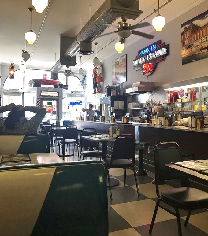 The counter where strangers become neighbors and calories don't count. Notice how nobody's staring at their phone?