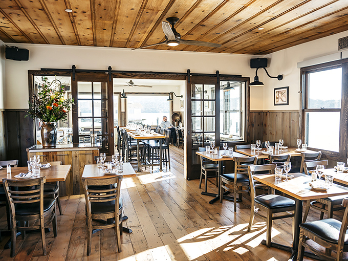 Sunlight streams through windows onto wooden floors, creating the kind of dining room where memories are made between bites.