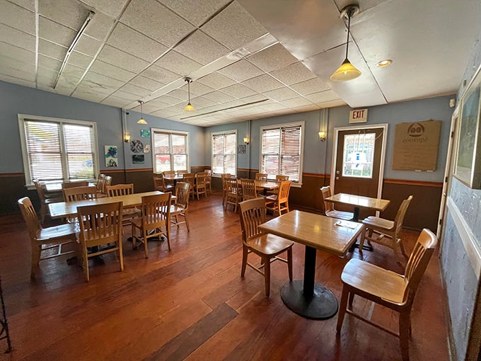 Warm wood tones and blue walls create a dining room that feels like your stylish friend's country home.