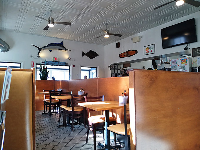The dining area keeps it simple with mounted fish watching over your meal like approving ancestors of what's on your plate.
