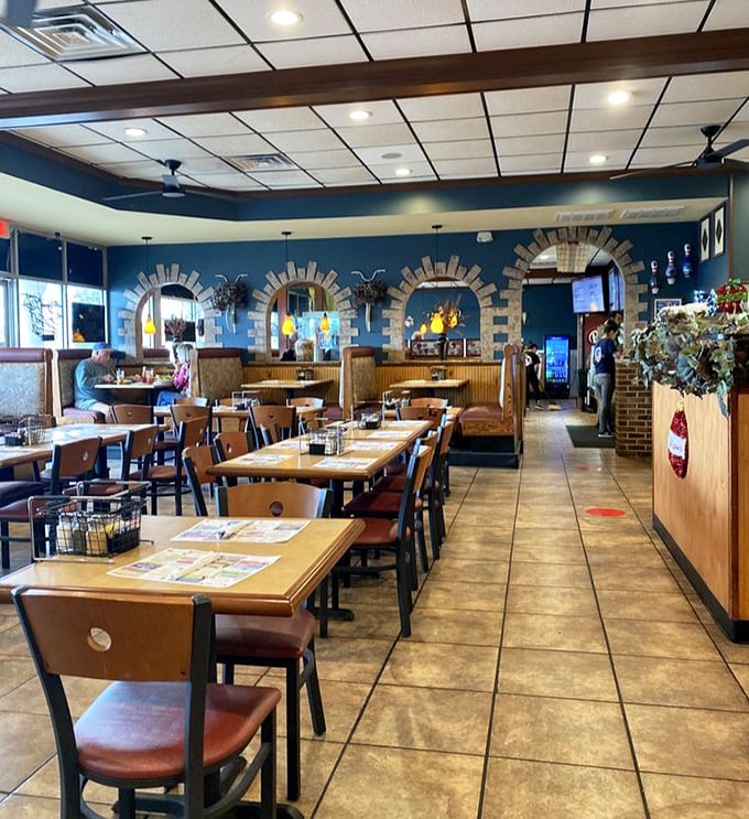 The dining area where locals become regulars and tourists become converts. Those decorative arches have seen some serious eating.