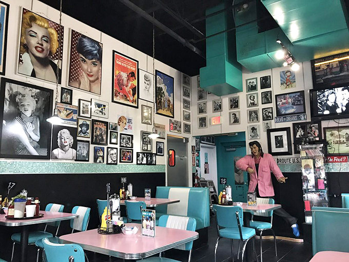Pink tables, turquoise booths, and walls plastered with memories of simpler times. Even Elvis would feel at home in this corner of nostalgic nirvana.