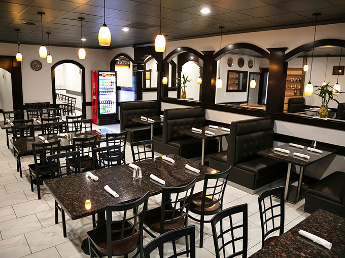 The dining area balances elegance with comfort, where granite-topped tables and pendant lights create an atmosphere worth lingering in.