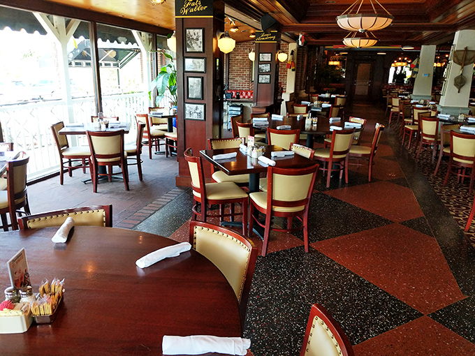 The dining room's warm wood tones and distinctive floor pattern create the perfect backdrop for the food drama about to unfold at your table.