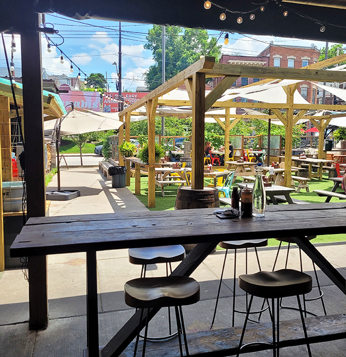 The view from inside looking out reveals a lively outdoor space where BBQ and sunshine create the perfect Pittsburgh afternoon. No wonder everyone looks so happy.