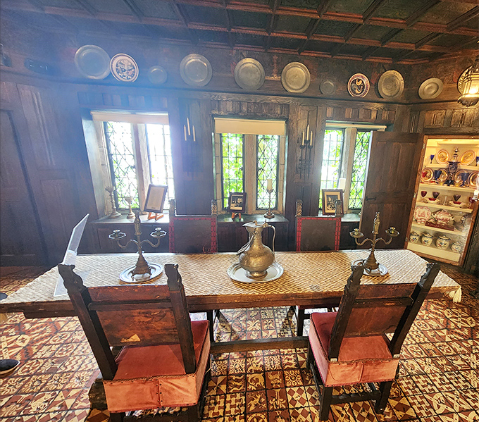 Dining medieval-style meant surrounding yourself with dark wood, decorative plates, and enough atmosphere to feed the soul before the meal.