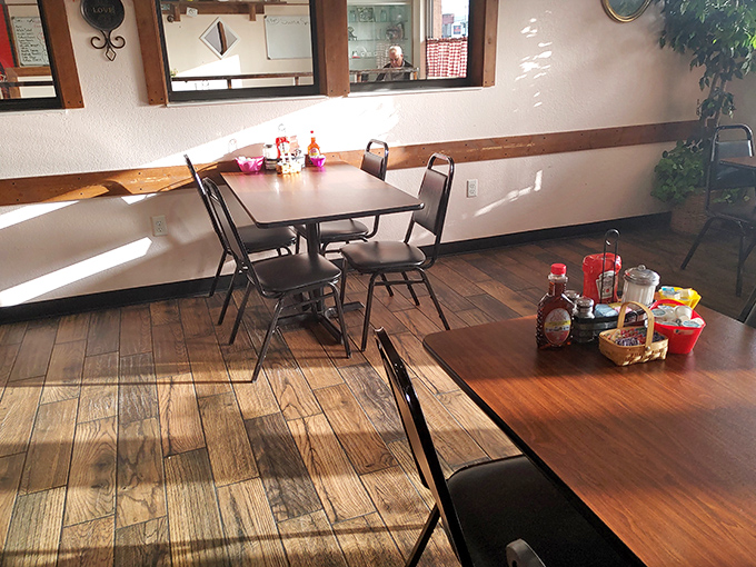 Sunlight streams through windows onto simple wooden tables. In an age of Instagram-designed spaces, this authentic charm feels like coming home.