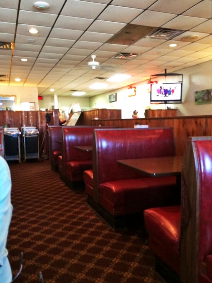 These burgundy booths have supported generations of happy diners, creating a timeless backdrop for countless family meals and first dates.