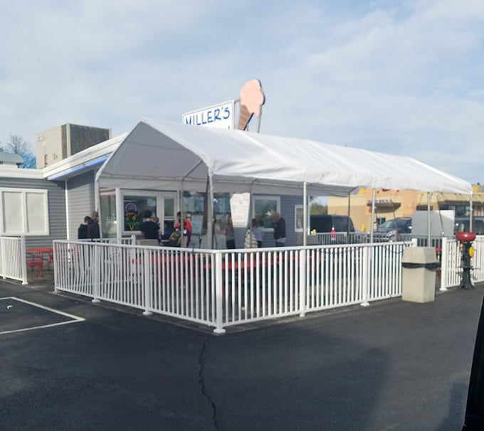 The white picket fence isn't just decorative&mdash;it's containing all that deliciousness from escaping into the wild. Drive-in dining at its finest.