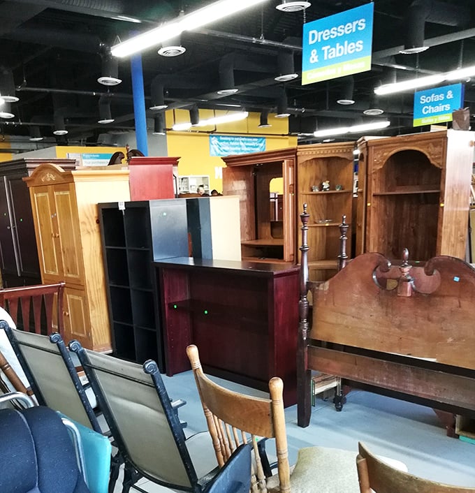 The dresser section looks like a furniture family reunion &ndash; mid-century modern mingling with colonial cousins under bright warehouse lights.