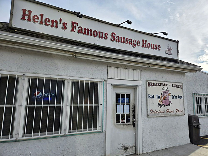 The sign promises "Famous" sausage, and unlike most roadside claims, this one delivers. Helen's has earned every letter of that boast.