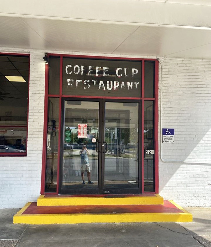 Red-framed entrance beckoning hungry patrons like the pearly gates of breakfast heaven – complete with accessibility for all believers.