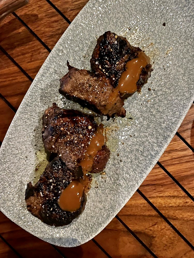 Three perfect medallions of filet mignon with a sauce that should be bottled and sold as liquid gold. Meat candy for grown-ups.