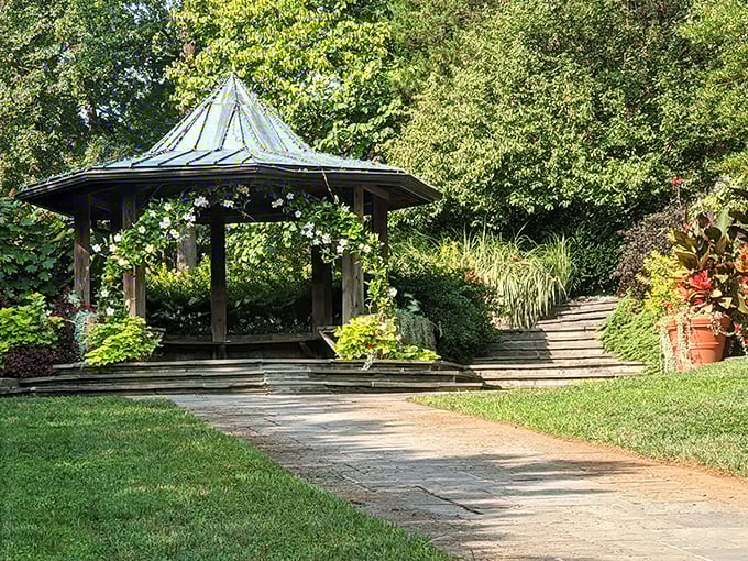 The traditional gazebo sits peacefully among manicured lawns, offering shade and contemplation without asking for anything back.