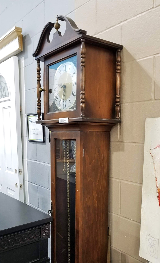 The grandfather clock stands ready to bring distinguished charm and hourly chimes to someone's entryway for considerably less than antique store pricing.