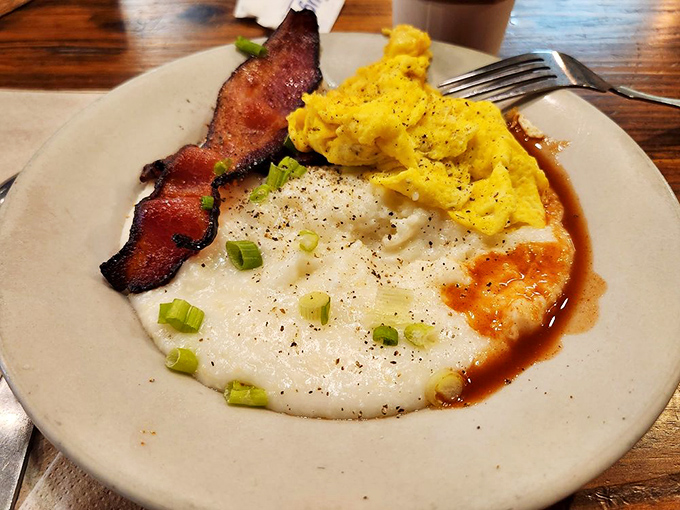 Grits that could convert even the most dedicated Northerner. Creamy, buttery perfection topped with eggs and bacon&mdash;comfort in a bowl.