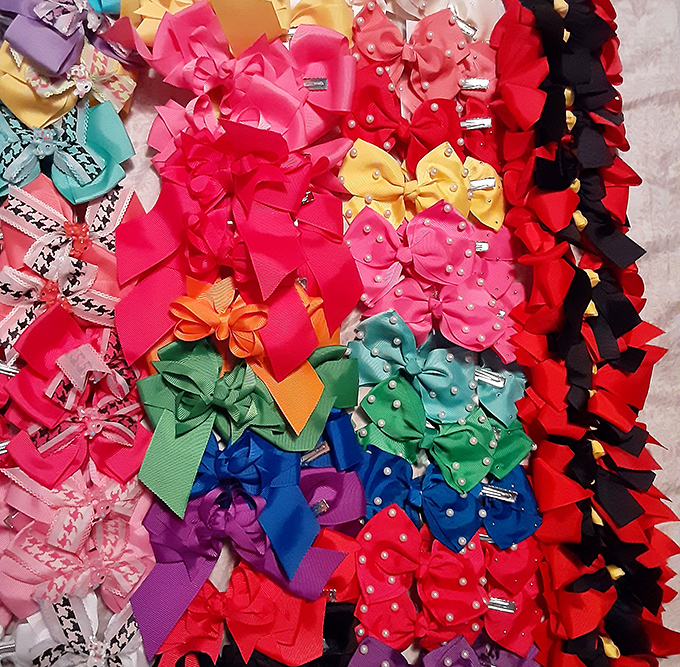 A rainbow explosion of hair bows that would make JoJo Siwa weep with joy. Your daughter's hair accessories drawer is about to get serious competition.