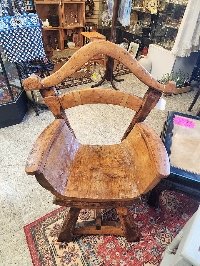 A handcrafted wooden chair that's survived longer than most modern relationships and looks better with age.