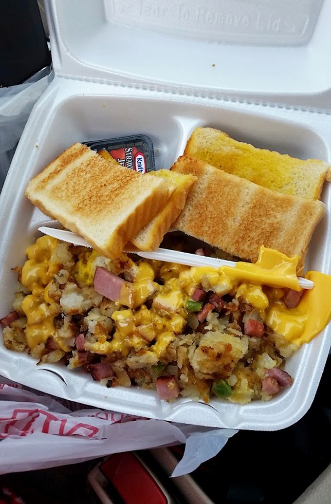 Comfort food reimagined: golden potatoes, ham, and melted cheese with toast on the side&mdash;the breakfast of champions any time of day.