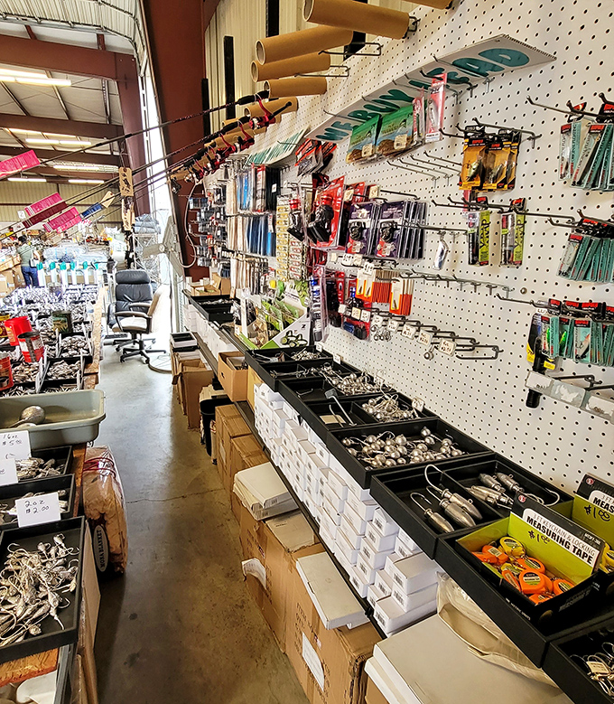 Hardware and tools line the walls of this indoor vendor space, organized with the precision of someone's very tidy garage.