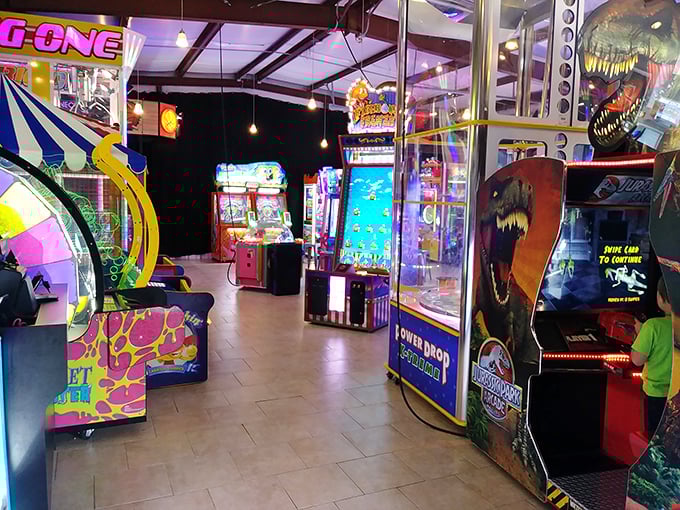 Jurassic Park arcade games and carnival classics create a sensory overload that kids and nostalgic adults equally adore.