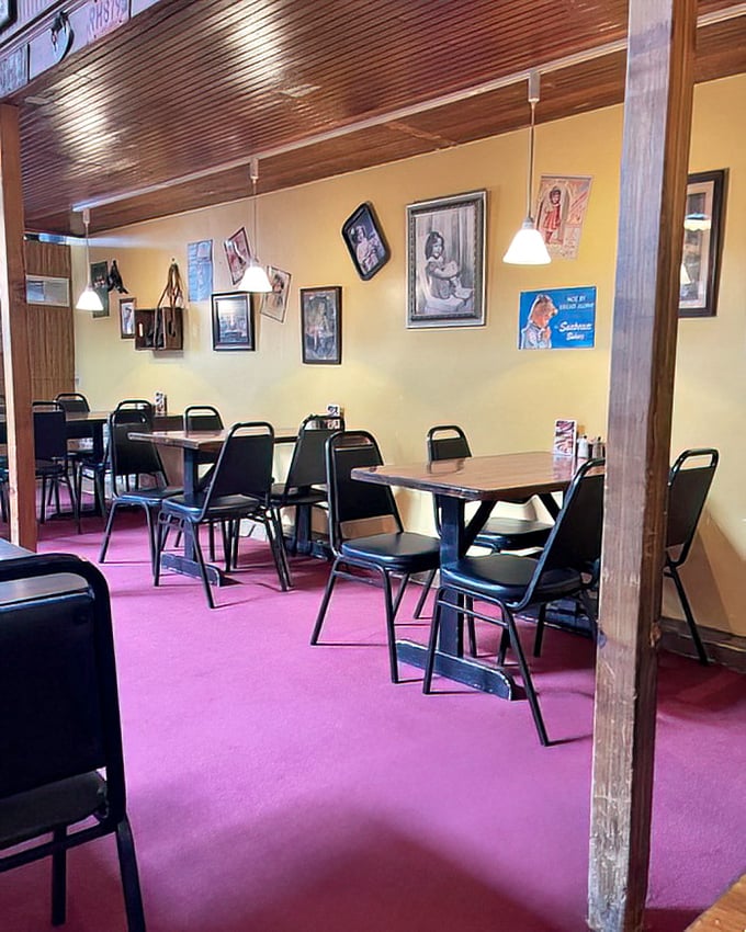 The dining room's purple carpet and wooden accents create the perfect backdrop for the main event that's about to arrive on your plate.