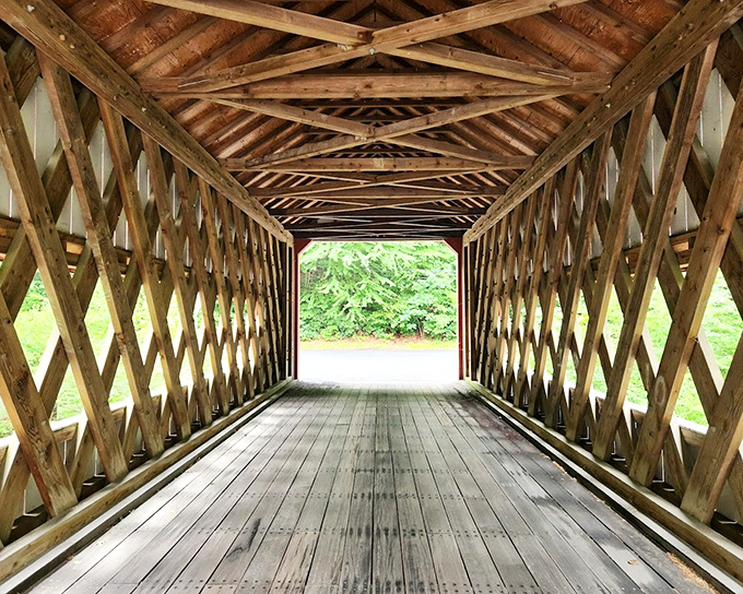 Walking through feels like entering a wooden cathedral, where sunlight filters through lattice work creating ever-changing patterns on the planks below.