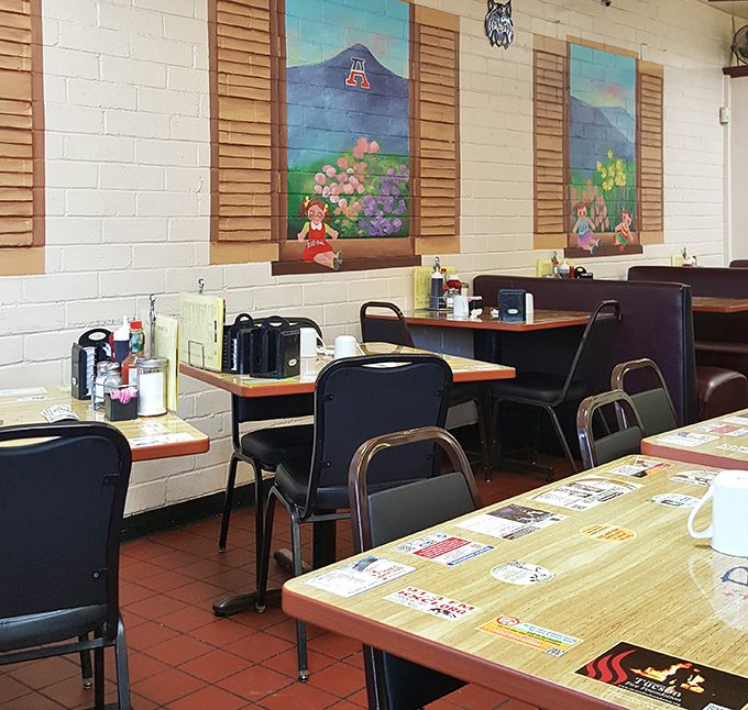 Charming murals add a touch of whimsy to the no-frills dining room, where every table feels like the best seat in the house.